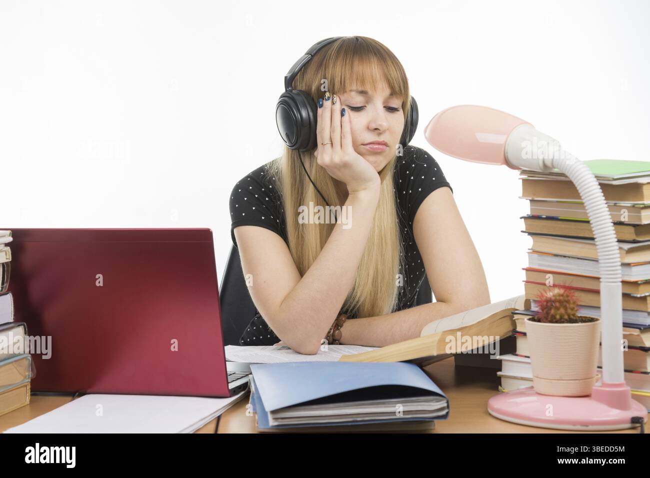Student Falling Asleep Reading A Reference Book Stock Photo Alamy
