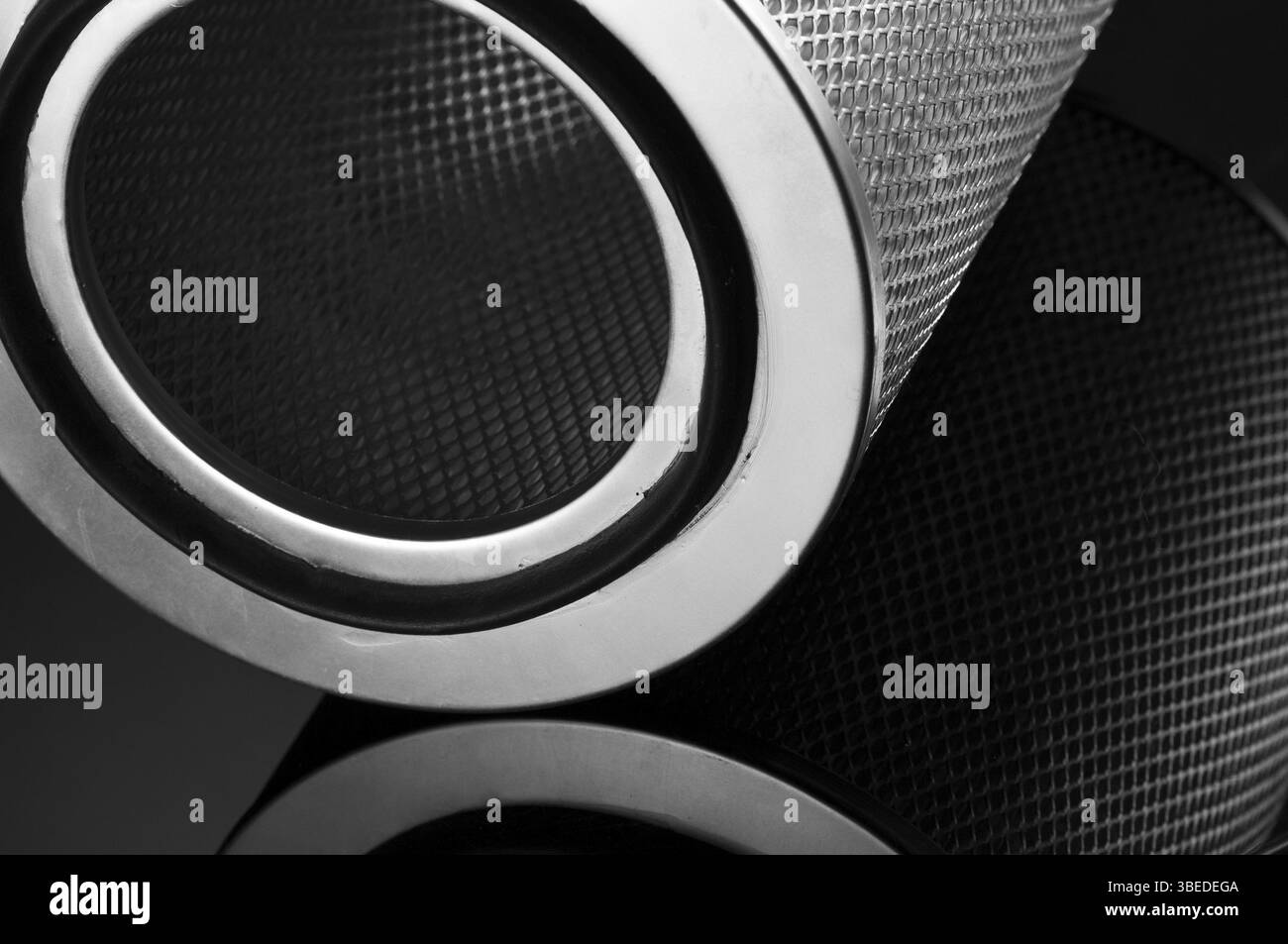 Automotive filter cylindrical shape on a black background with ...