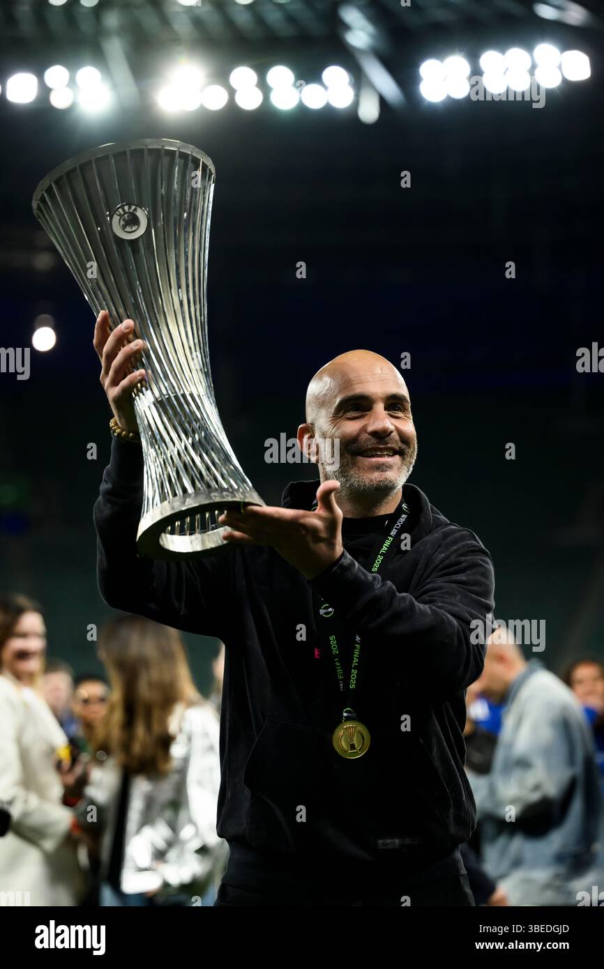 Enzo Maresca, head coach of Chelsea FC, lifts the trophy during the ...
