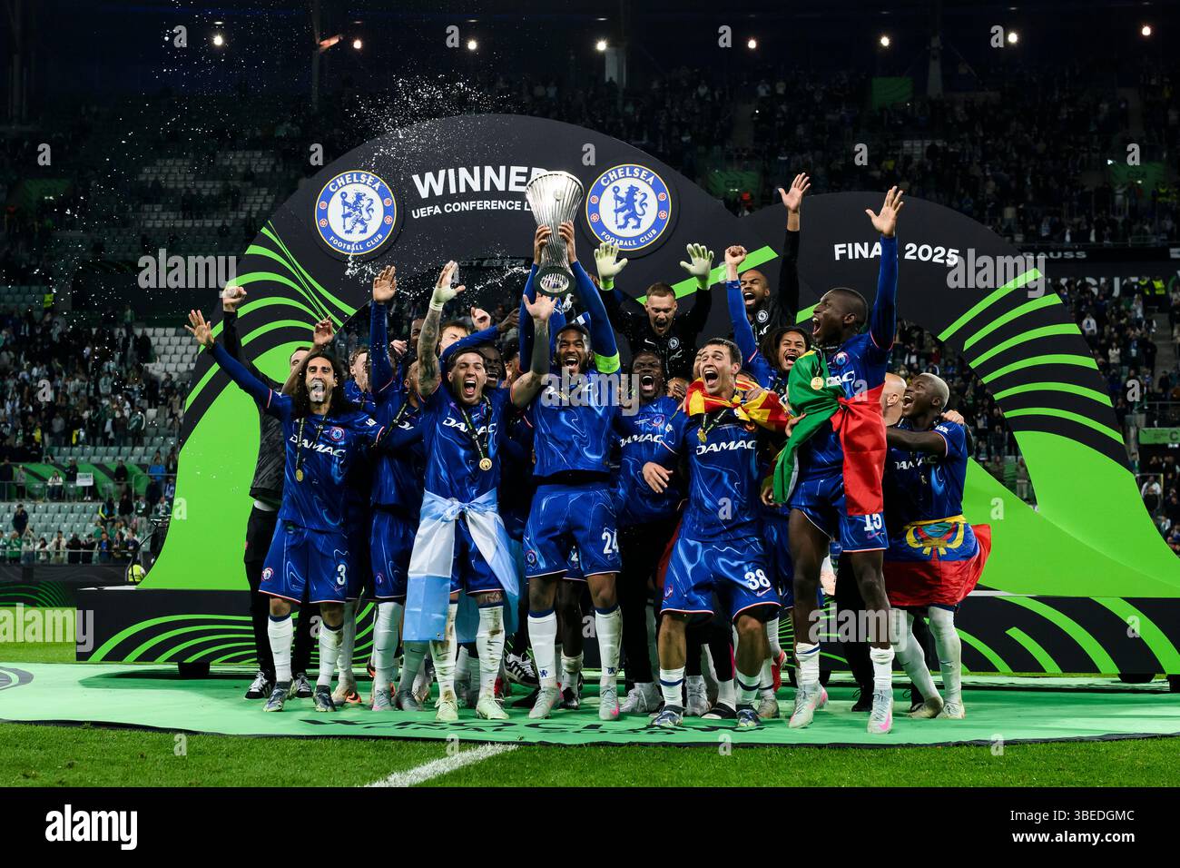 Reece James of Chelsea FC lifts the trophy as teammates celebrate ...