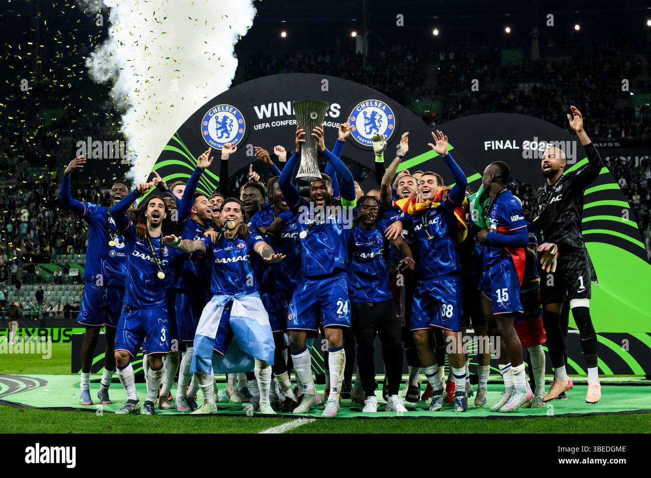 Reece James of Chelsea FC lifts the trophy as teammates celebrate ...