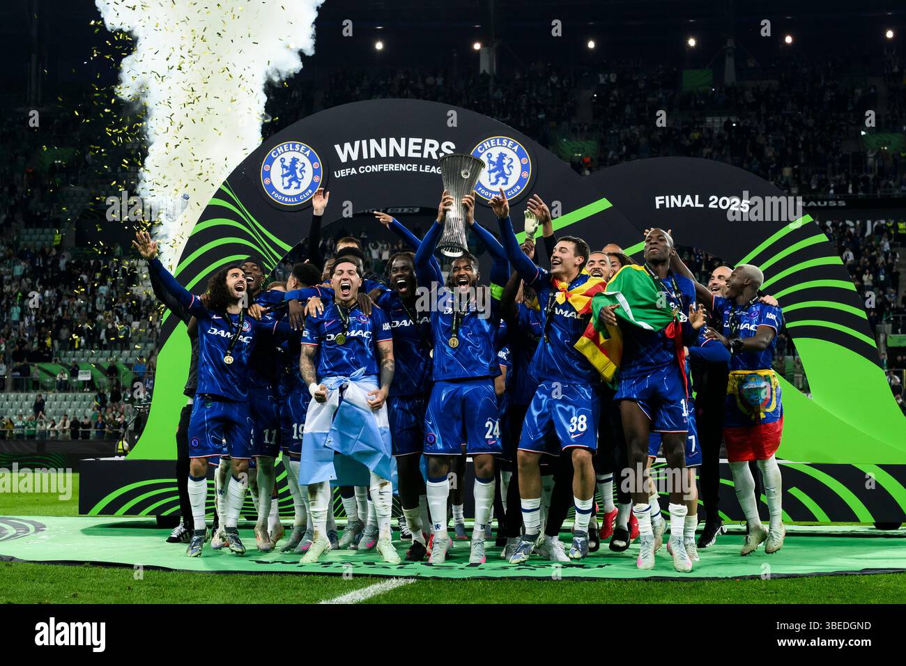 Reece James of Chelsea FC lifts the trophy as teammates celebrate ...