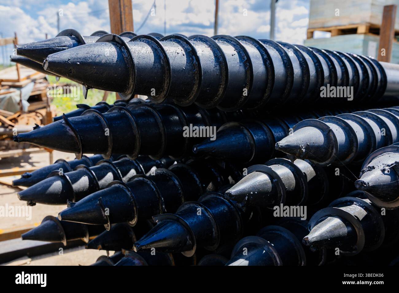 Stack of screw piles for house foundation Stock Photo - Alamy