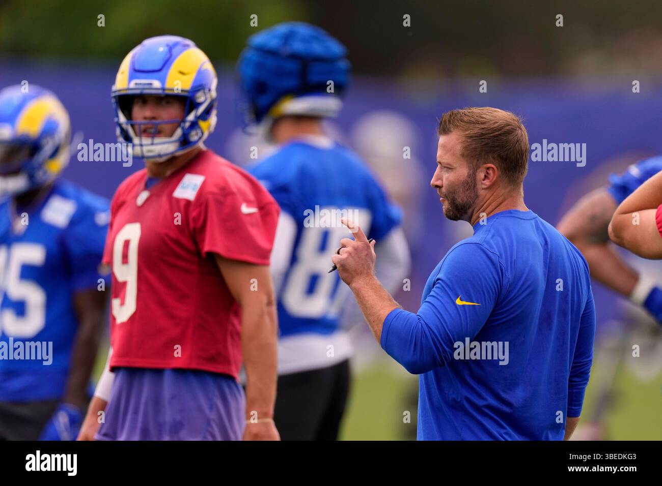 Los Angeles Rams quarterback Matthew Stafford, left, talks with head ...