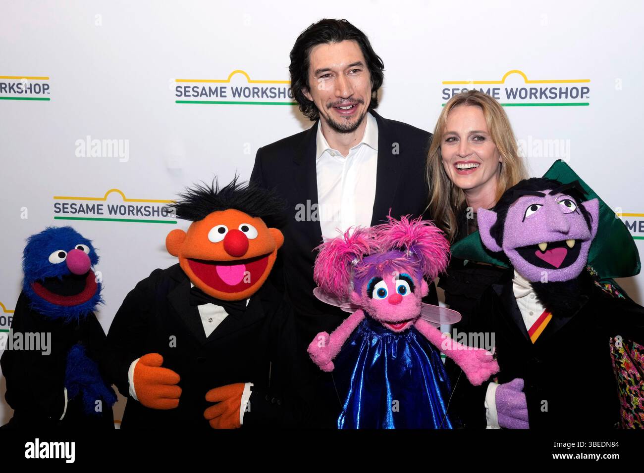 Adam Driver and Joanne Tucker pose with Sesame Street Muppets at the ...