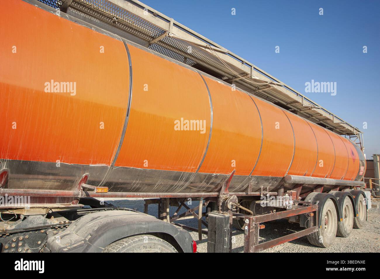 A closeup gas red tanker truck at an industrial construction site Stock ...