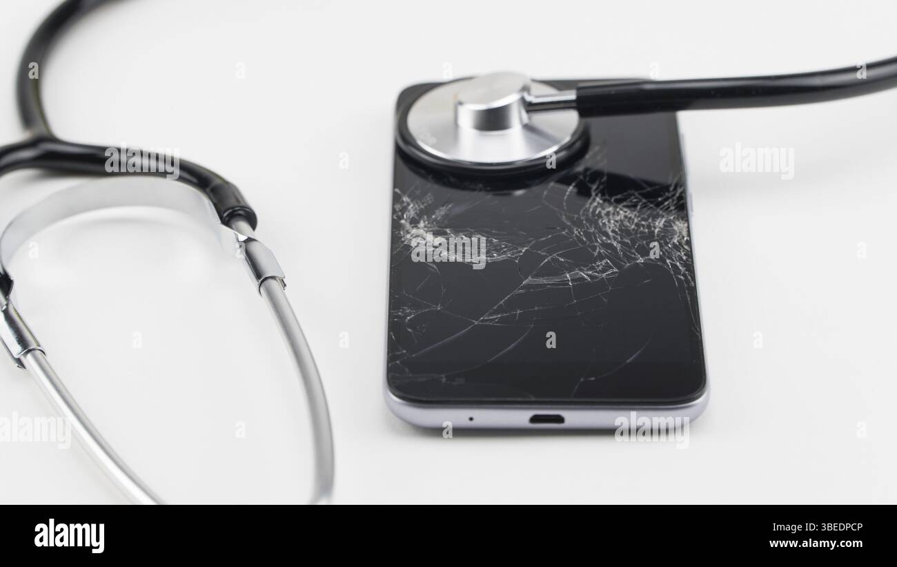 Diagnosing the phone with a stethoscope, near a screwdriver. Phone ...