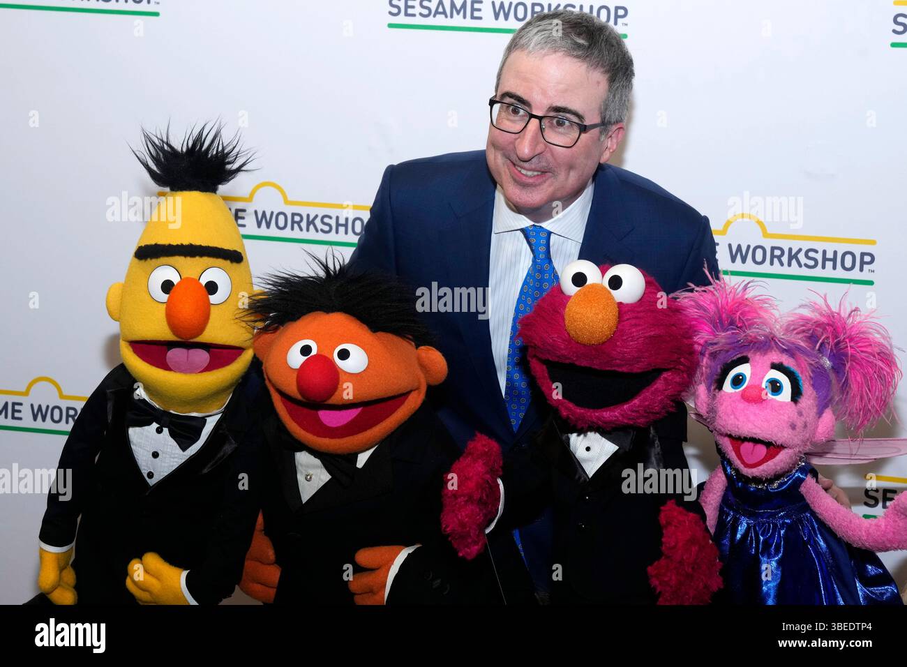 John Oliver poses with Sesame Street Muppets at the Sesame Workshop ...