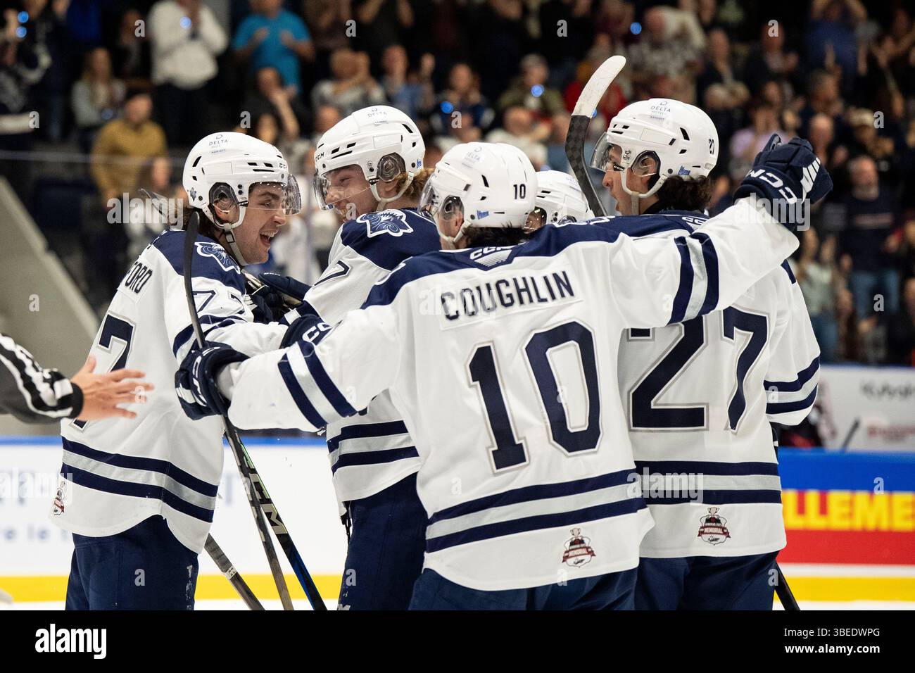 Rimouski Oceanic's Mathieu Cataford (left), celebrates alongside ...