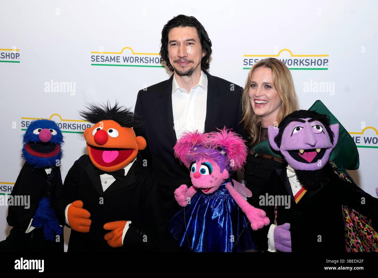 Adam Driver and Joanne Tucker pose with Sesame Street Muppets at the ...