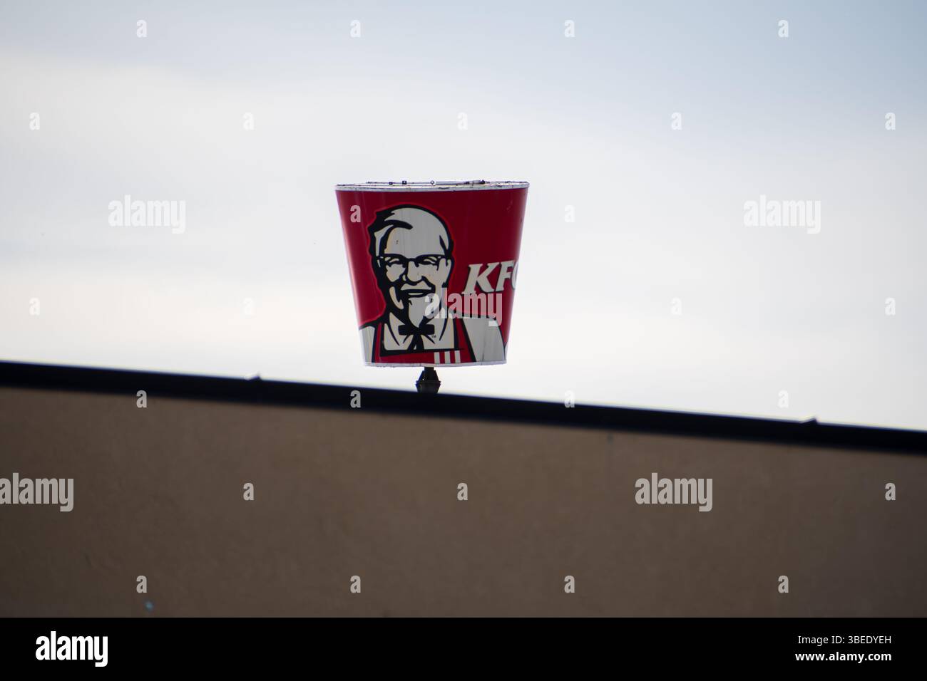 Spanish Fork, UT—May 28, 2025: A bucket of chicken sign sits atop a KFC ...