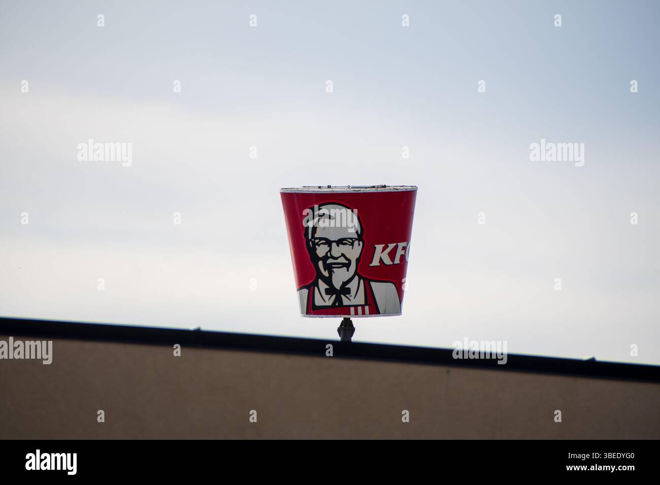 Spanish Fork, UT—May 28, 2025: A bucket of chicken sign sits atop a KFC ...