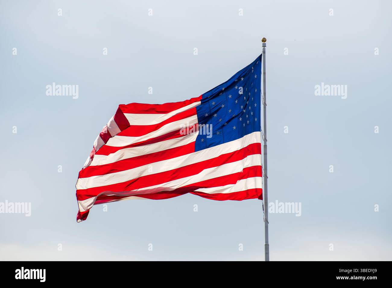 American Fork, UT—May 28, 2025: An American flag waves along Interstate ...