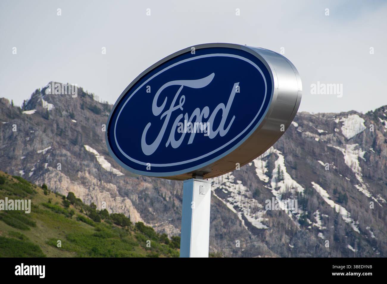SPANISH FORK, UATH, USA - MAY 28, 2025: A Ford dealership sign stands ...