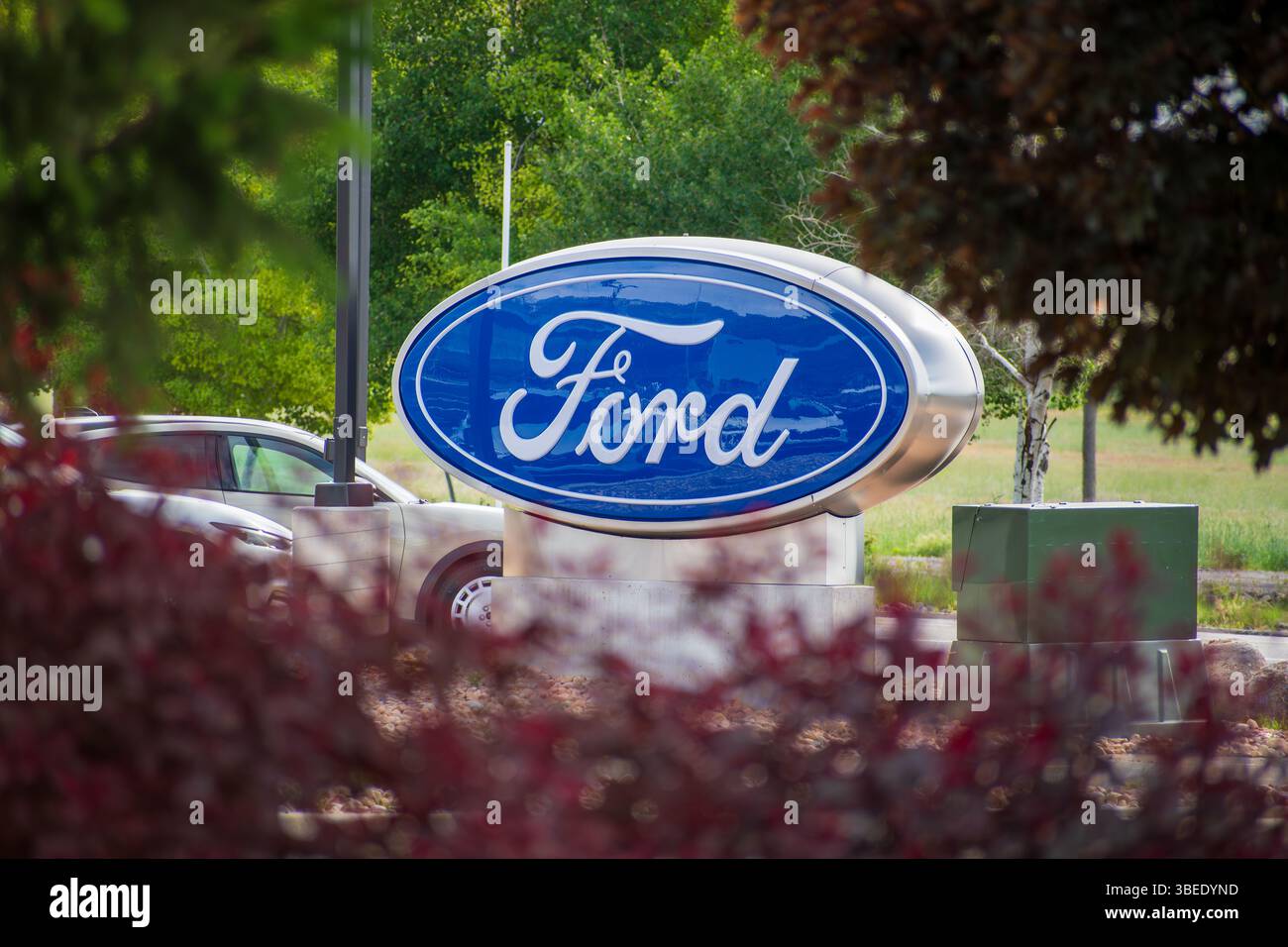 Spanish Fork, UT—May 28, 2025: A Ford dealership sign is partly visible ...