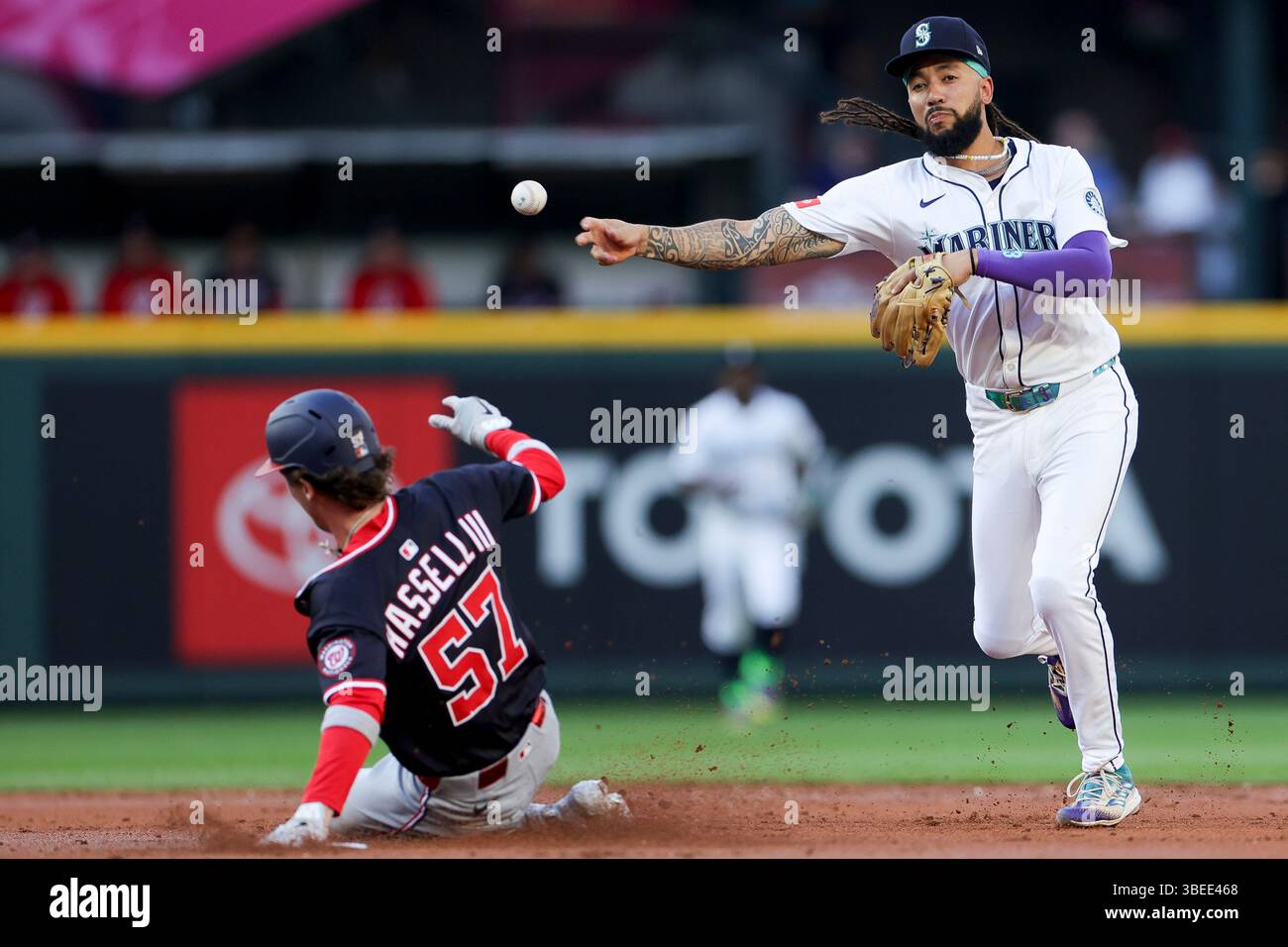 Seattle Mariners shortstop J.P. Crawford, right, throws out Washington ...