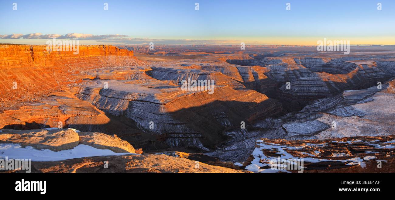 The entrenched canyons on the San Juan River are in shadow during a ...