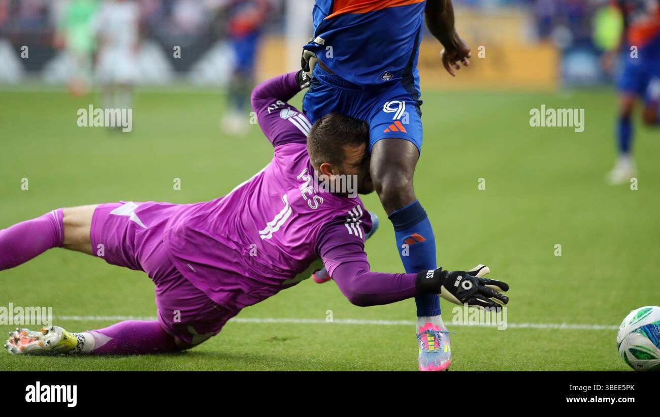 May 28, 2025: FC Dallas keeper Maarten Paes (purple) collides with FC ...