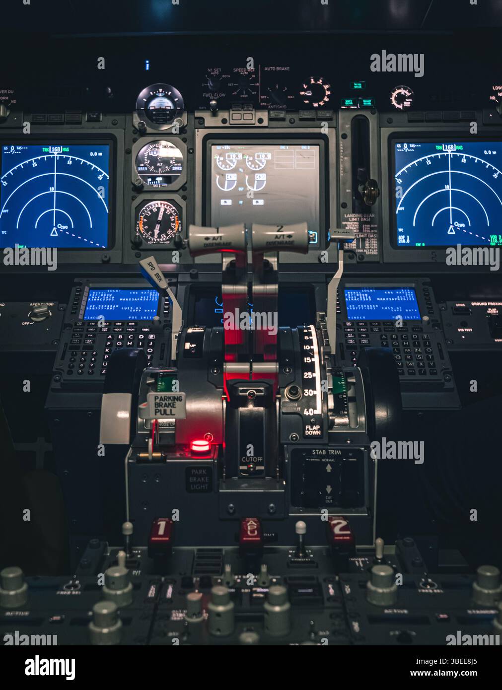 Cockpit view of an airplane during a night-time flight with illuminated ...