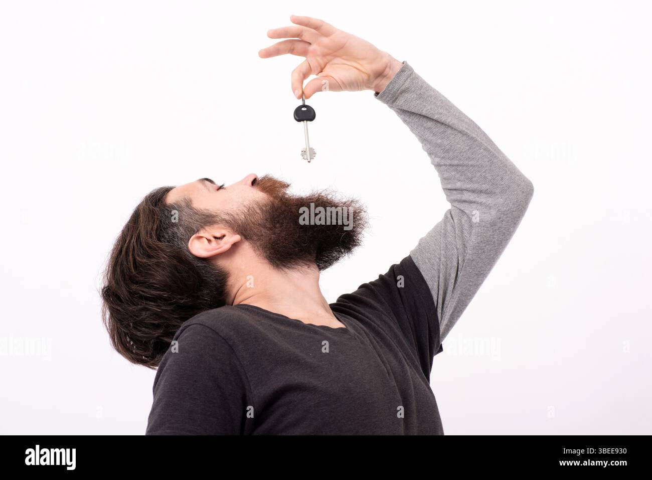 Key concept. Keys to success. Crazy homeowner. Funny bearded man got ...