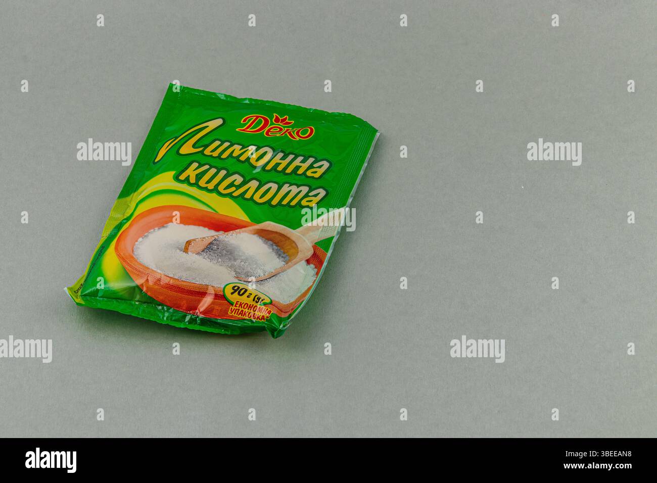 Lviv Ukraine 05.22.25 A green packet containing lemon acid sits on a ...