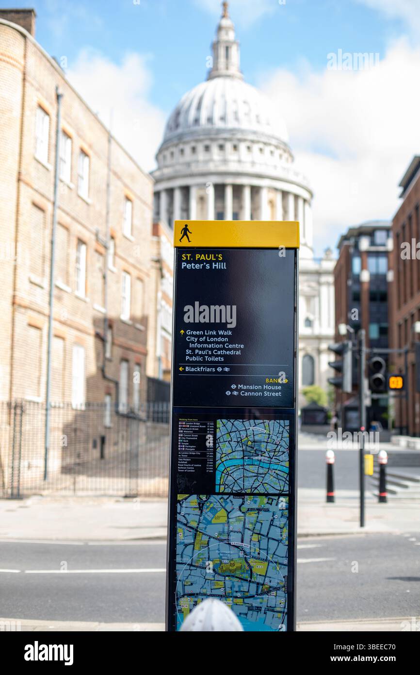 A directional sign near St. Pauls Cathedral in London with the dome ...
