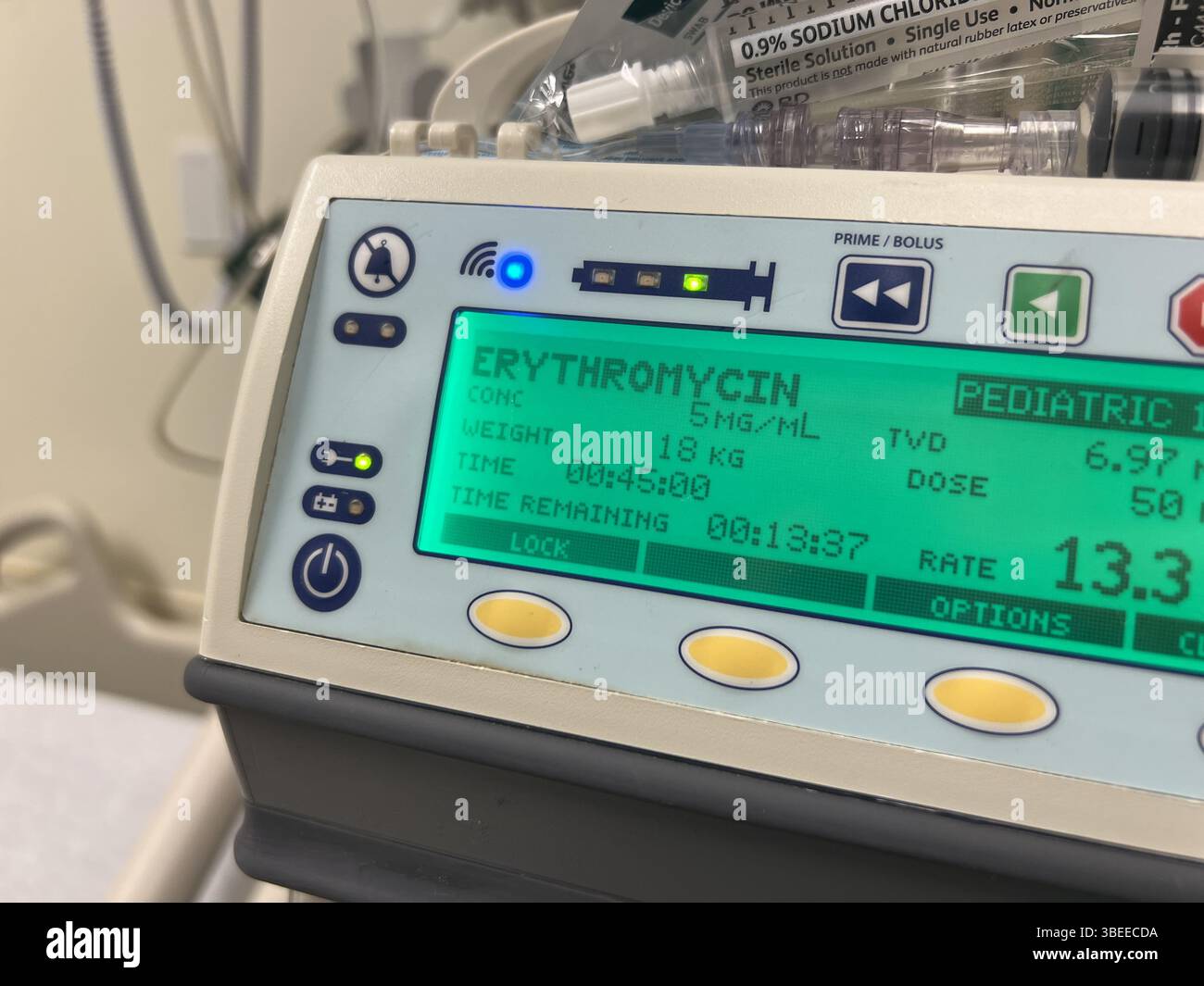Close-up of an intravenous infusion pump displaying Erythromycin dosage ...