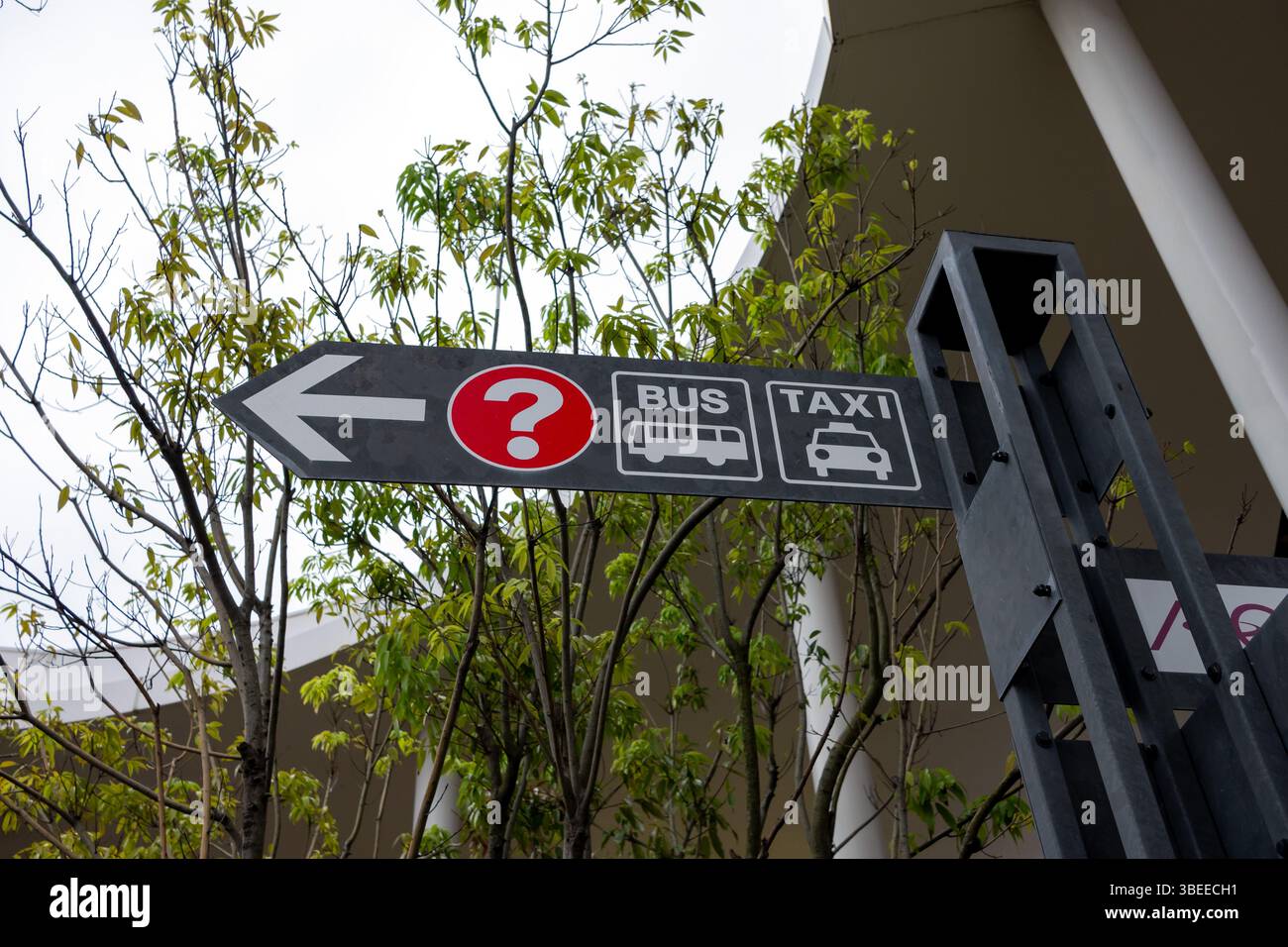 Bus and taxi signpost direction sign arrow Stock Photo - Alamy