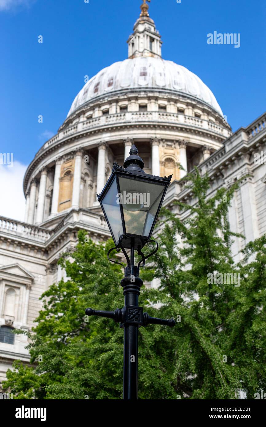 View of a traditional lamp post with St. Pauls Cathedral dome in London ...