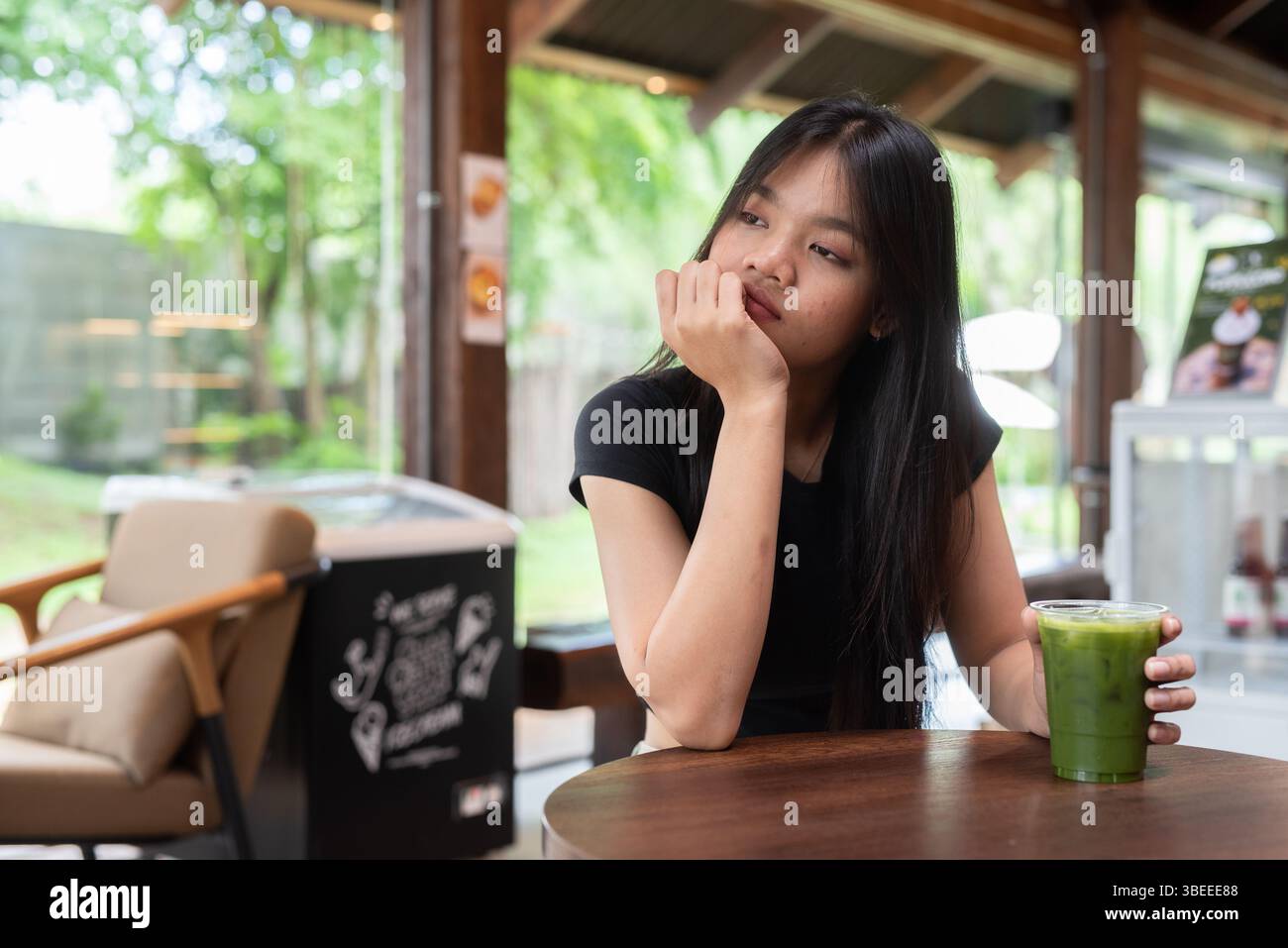 Young beautiful Asian student woman in cafe Stock Photo - Alamy