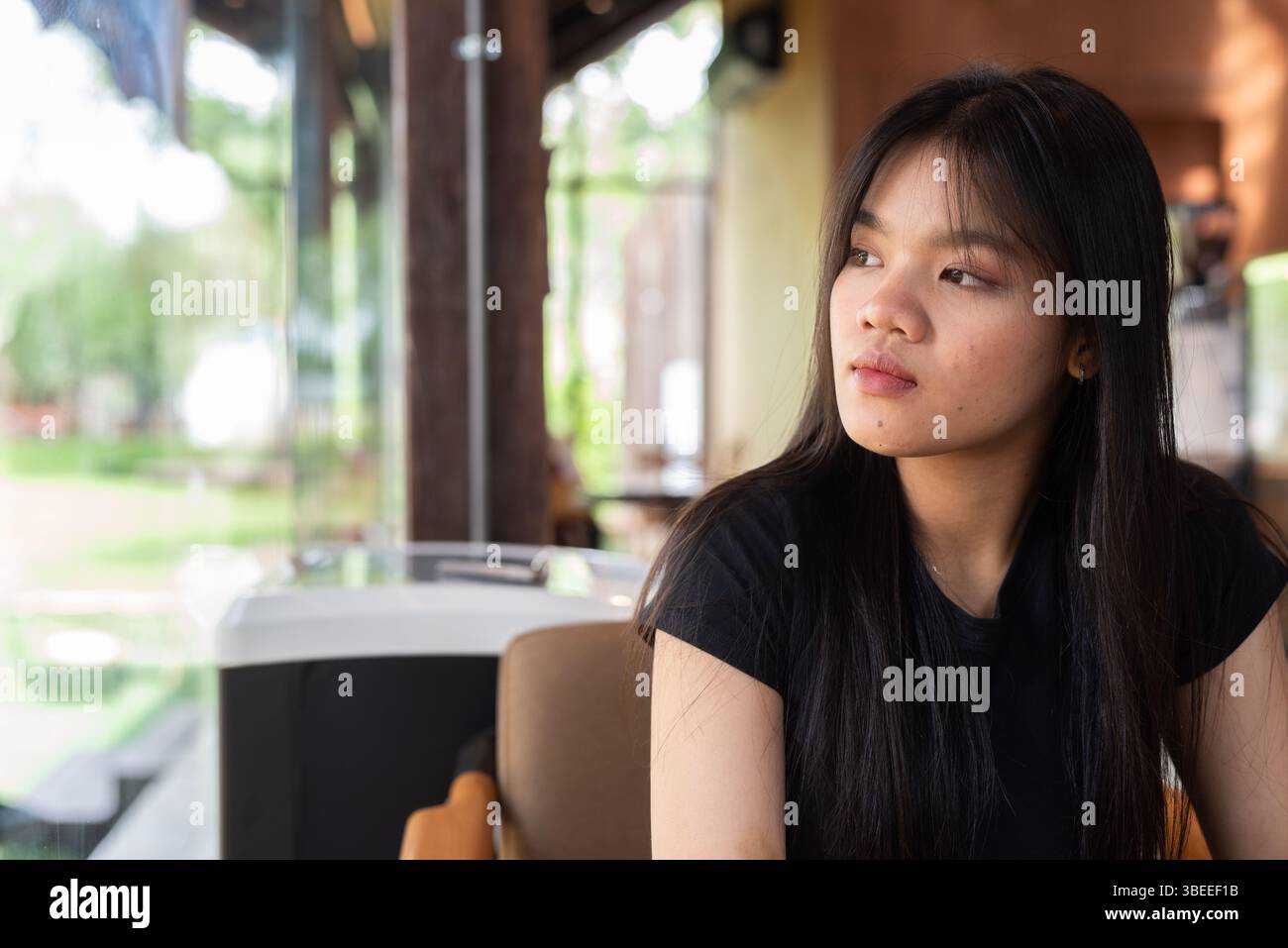 Young beautiful Asian student woman in cafe Stock Photo - Alamy