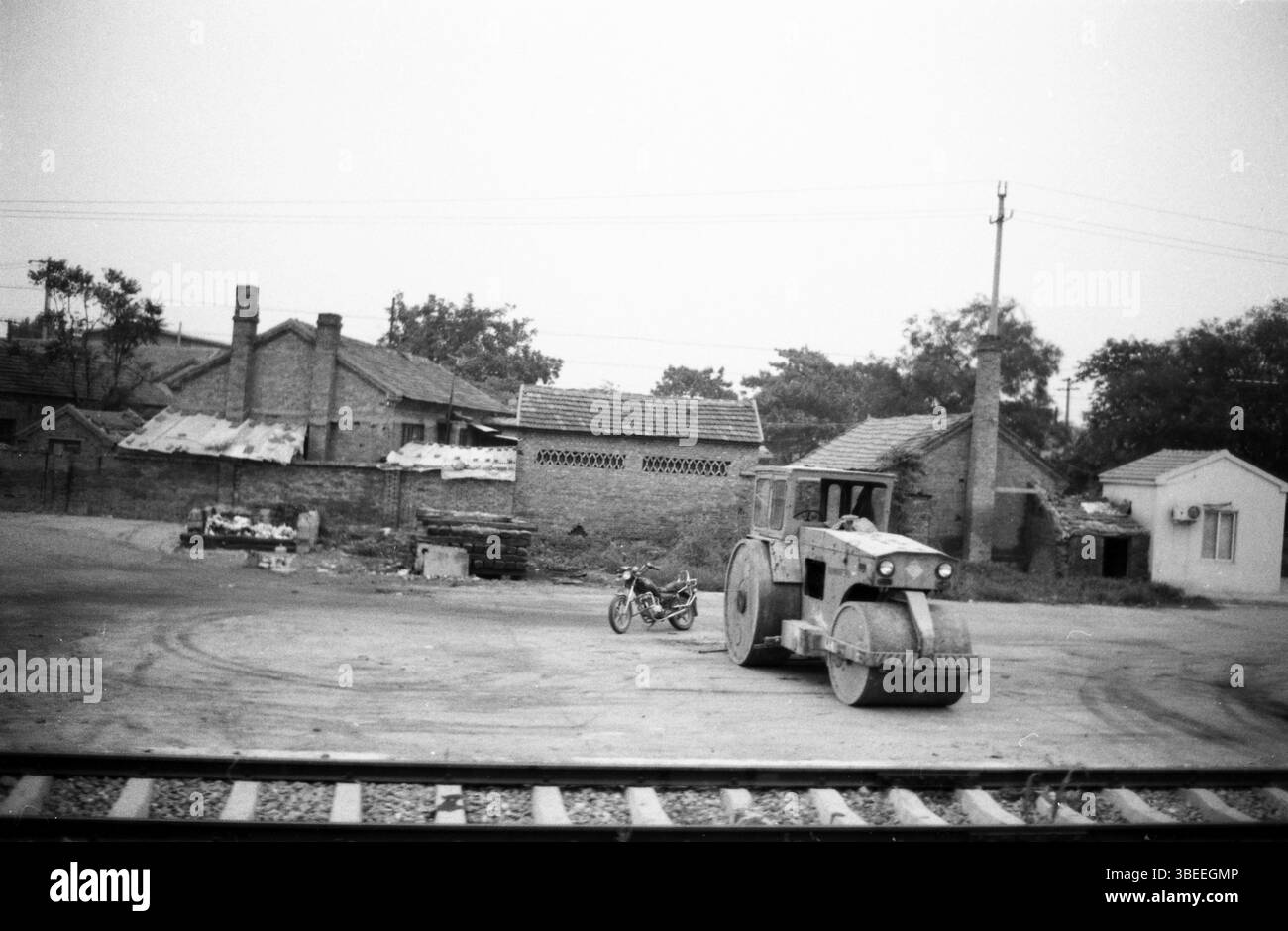 Late 2000s Chinese Train Station with Roller and Motorcycle on the ...