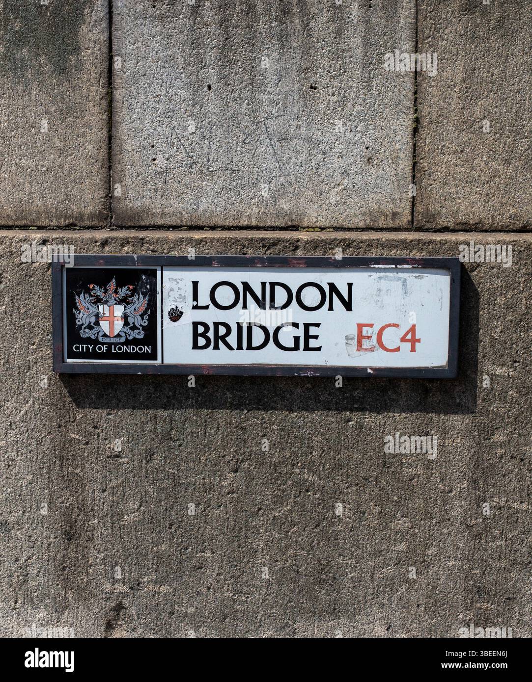 Close-up of London Bridge street sign on a concrete wall in London ...