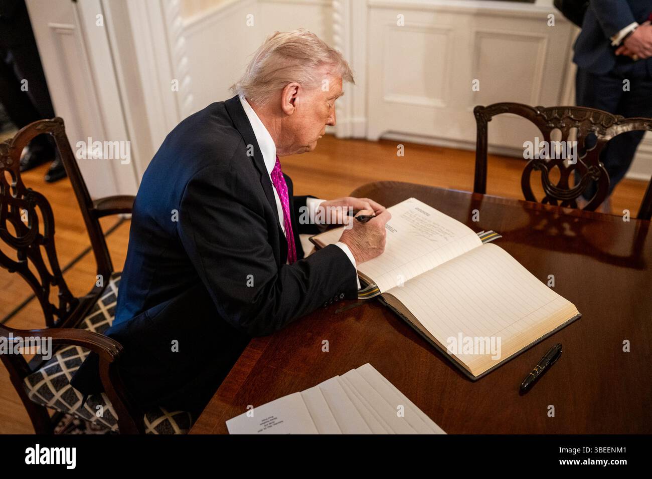 President Donald Trump signs the guest book at the superintendent ...