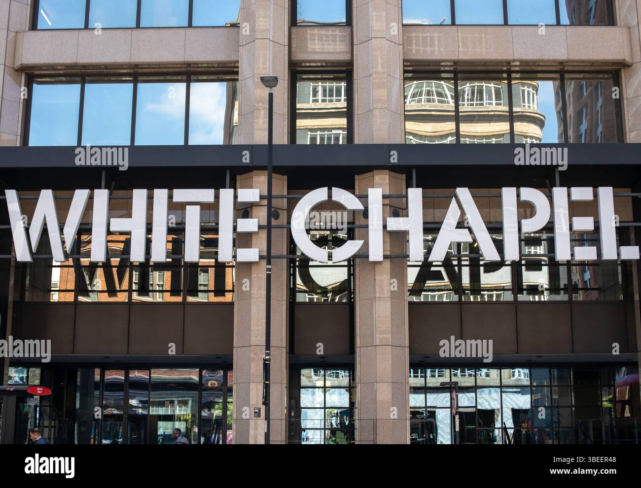 Entrance of the Whitechapel building in London with visible reflections ...