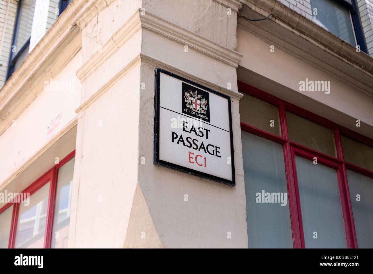 Street sign of East Passage in the City of London. The sign features ...