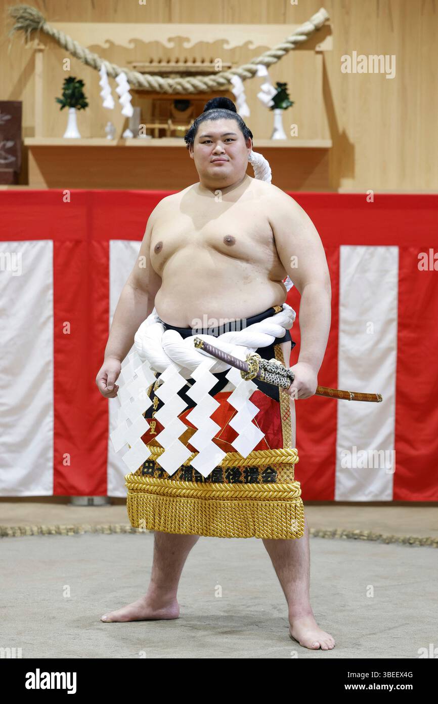 New Japanese Yokozuna Onosato tries a belt for upcoming ceremony at ...