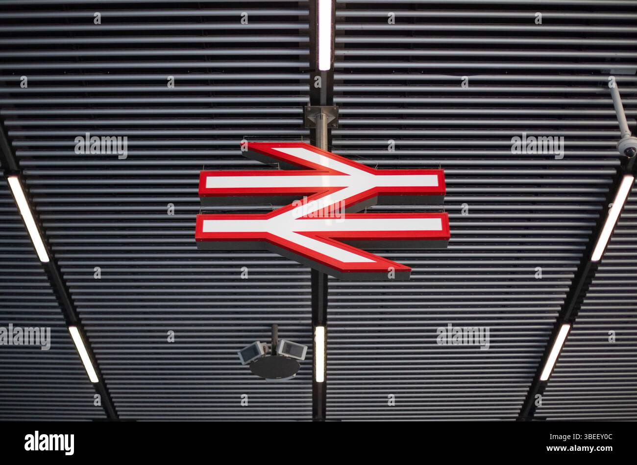The British Rail logo is displayed on the ceiling of a train station in ...