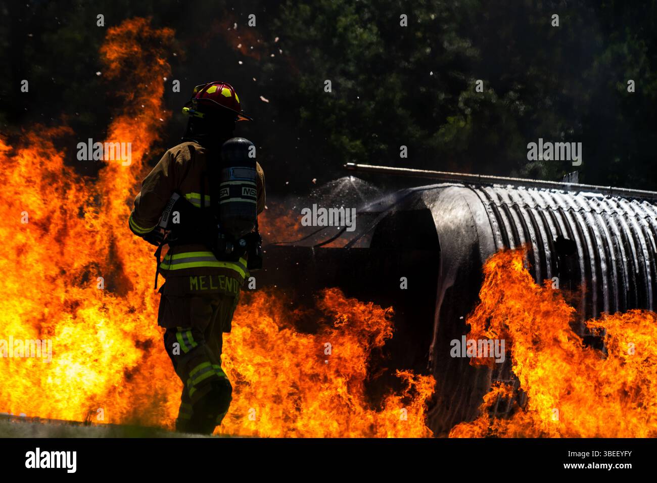 Firefighters assigned to the 628th Air Base Wing conduct a live fire ...