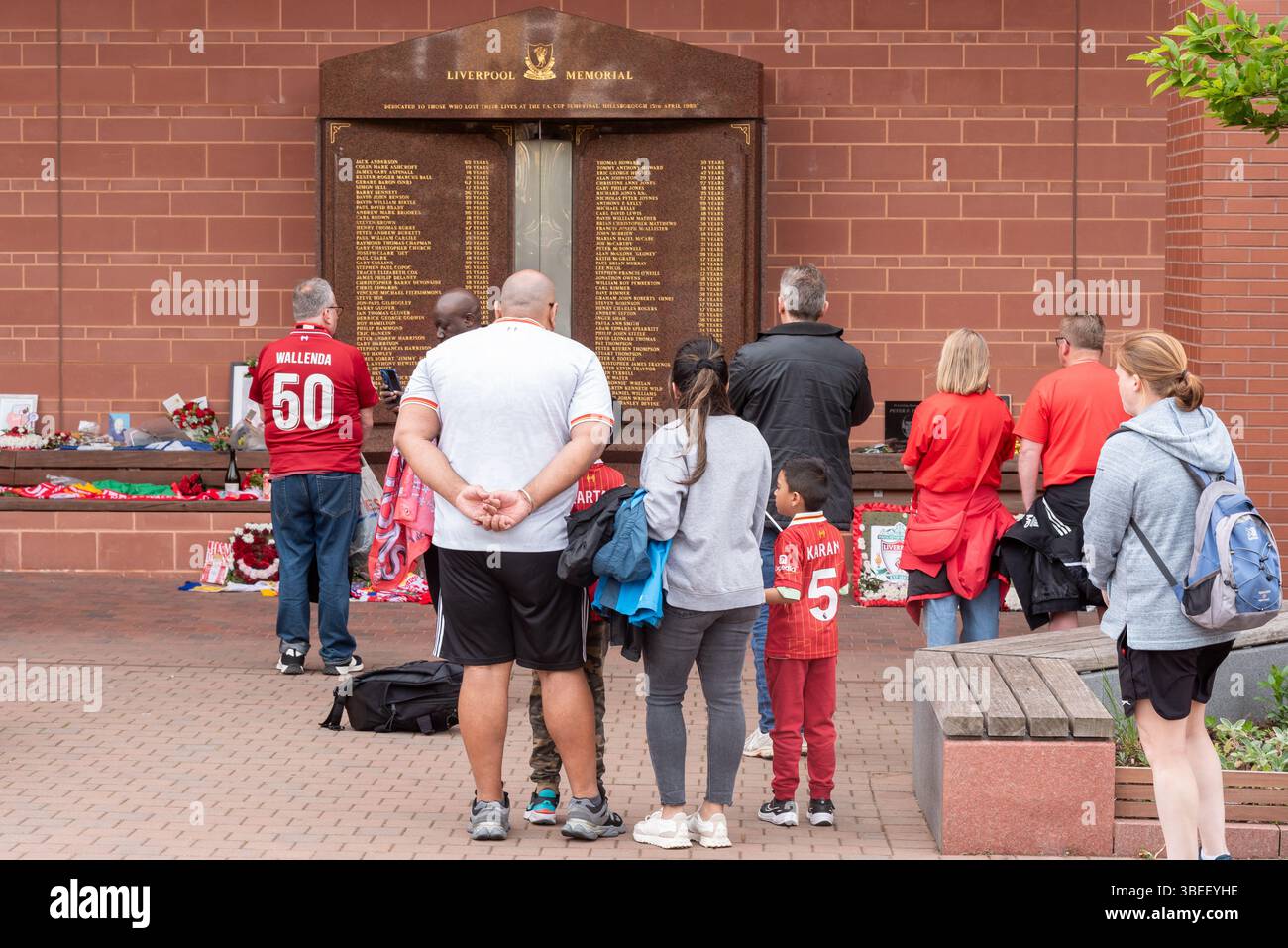 Liverpool supporters paying their respects at the The Hillsborough ...
