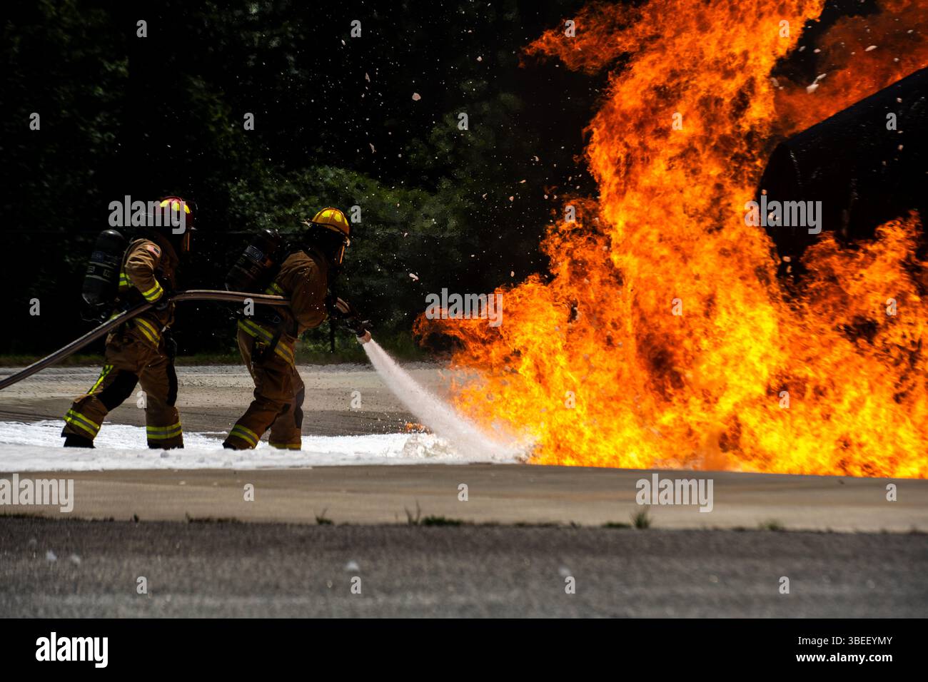 Firefighters assigned to the 628th Air Base Wing conduct a live fire ...