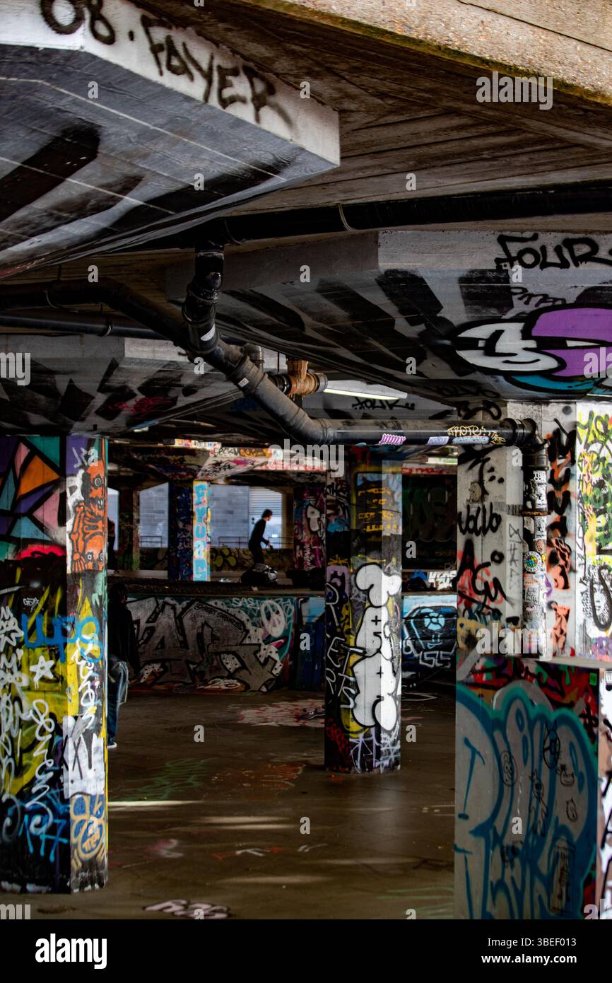 A vibrant indoor skate park in London featuring colorful graffiti art ...