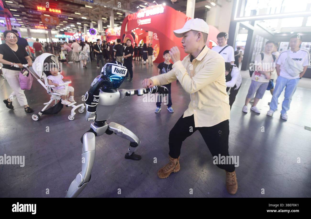 A boxing humanoid developed based on Unitree's G1 robot interacts with ...