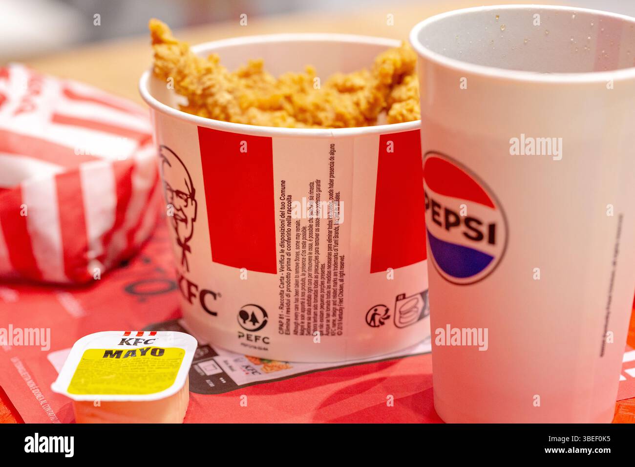 Padova, Italy - April 15, 2025: KFC fast food restaurant Strips bucket ...