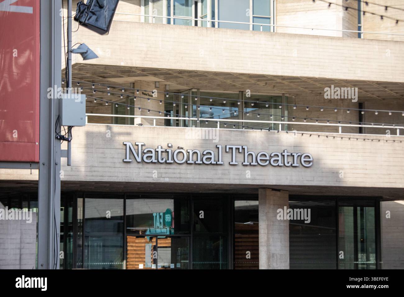 The image shows the iconic National Theatre building in London, known ...