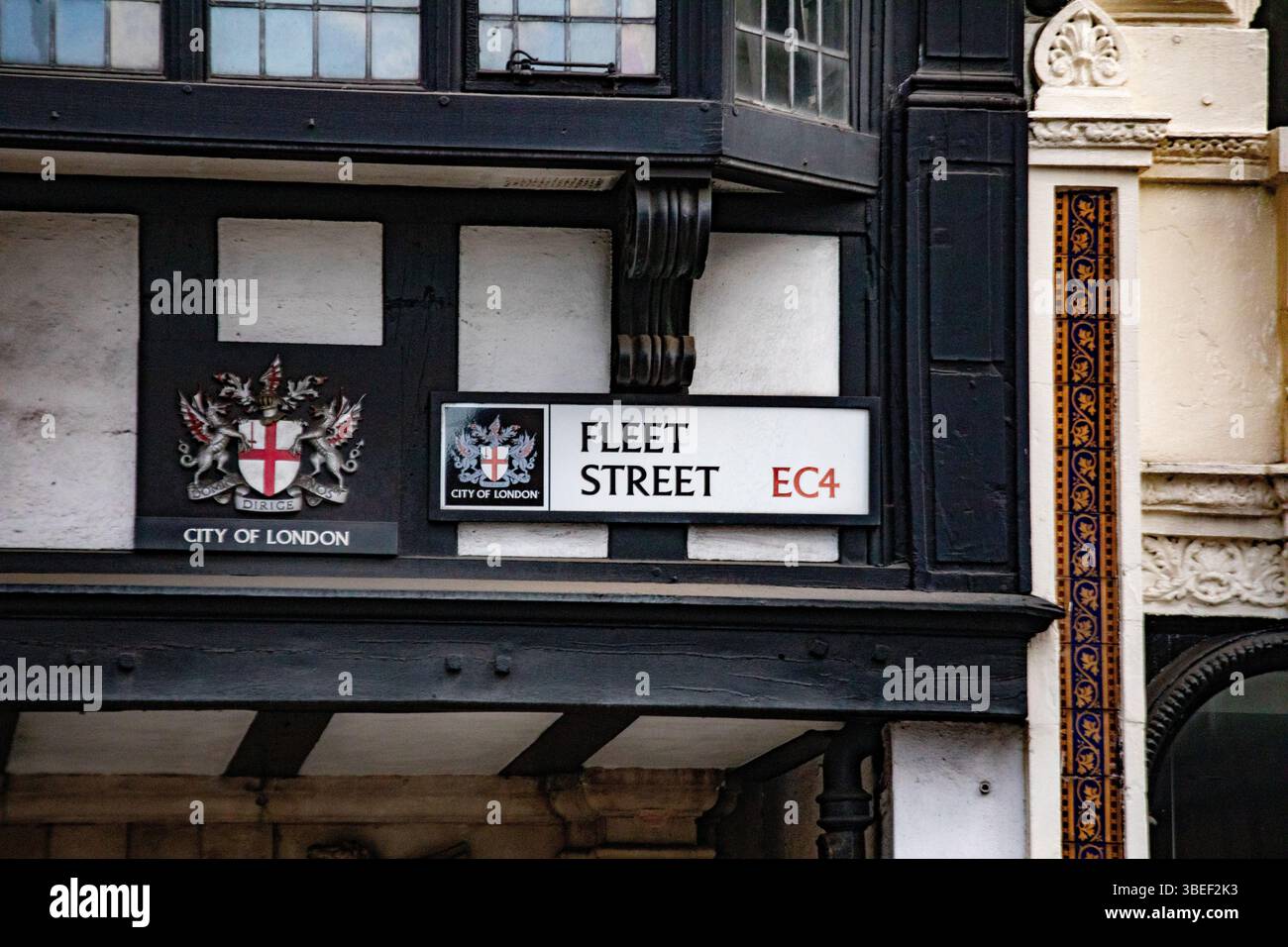 A close-up of the Fleet Street sign with the City of London crest ...