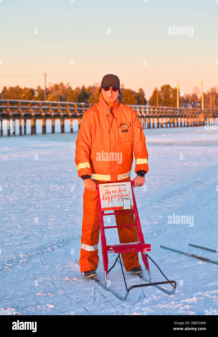 Senior Swedish man wearing orange thermal winter overalls coveralls ...