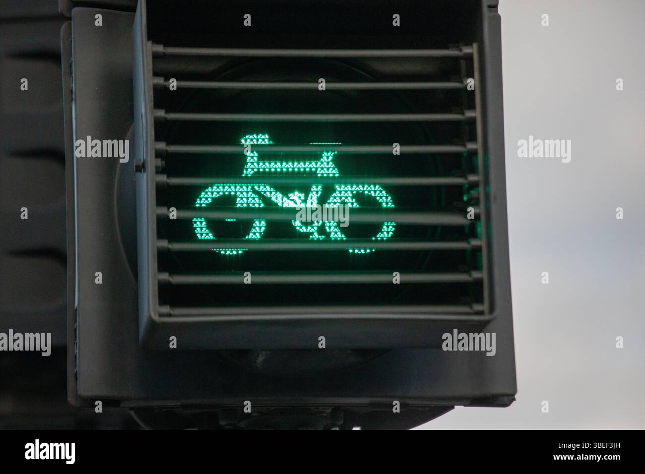 A green bicycle traffic light in London, signaling for cyclists to ...