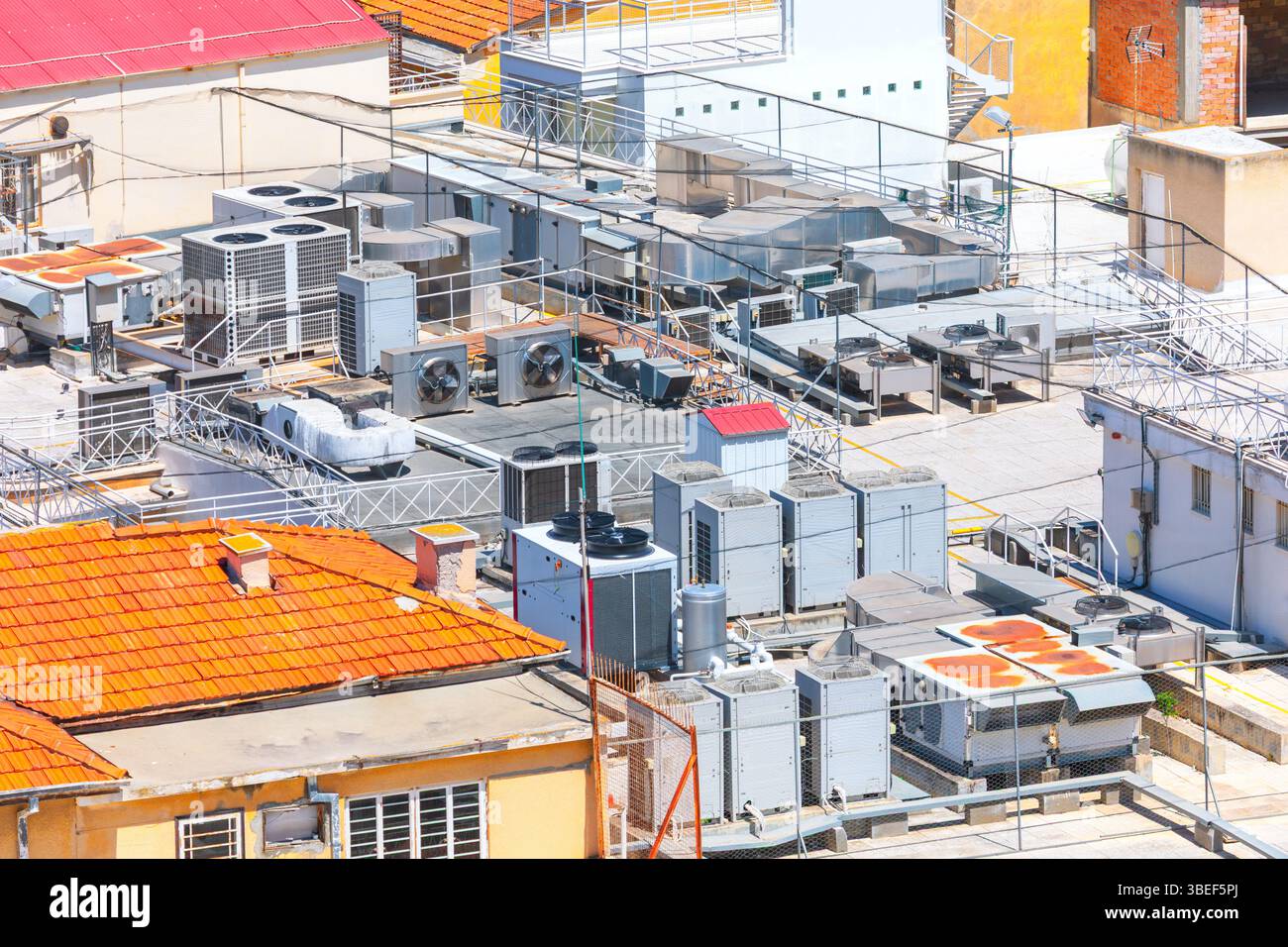 Rooftop packed with HVAC units with air conditioning, fans and ductwork ...
