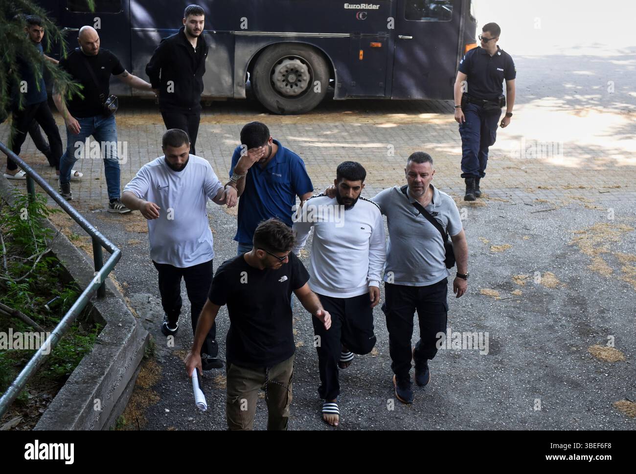 Suspect members of criminal gangs, based in Turkey, are escorted by ...
